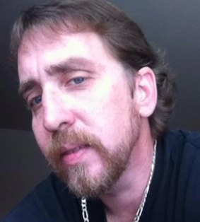 Photo of US school janitor Steve Weidner signing students' yearbooks ...