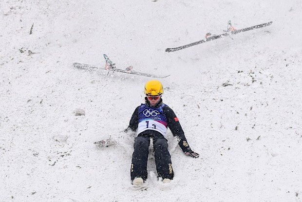 Tianma Li falls as he competes during the Mixed Team Aerials Final 2.