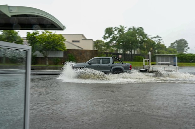 Ex-Tropical Cyclone Alfred: Police wade through deep floodwaters to ...