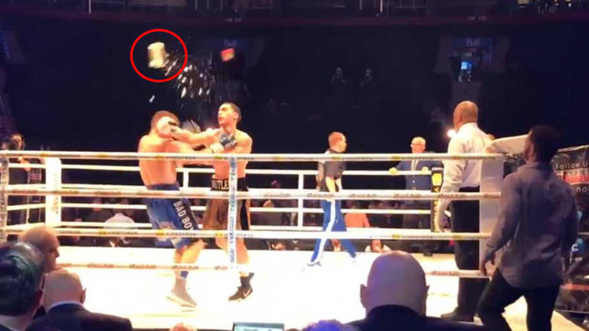 Boxer smashed in head by ice bucket in wild melee