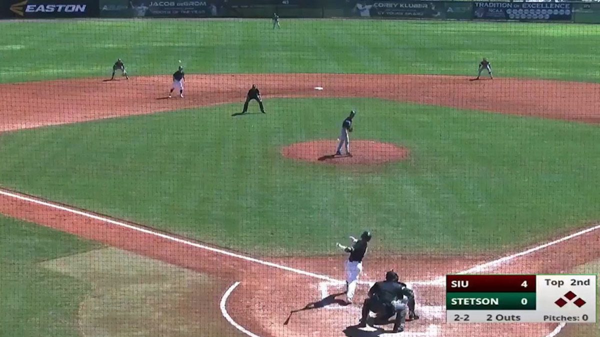 Outfielder bursts through wall chasing ball