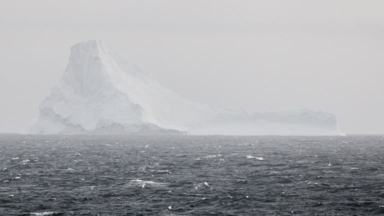 Photographer captures rare shot of flipped iceberg's underbelly