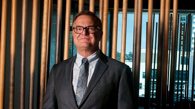 BOQ lifts first half profit, sells insurance unit