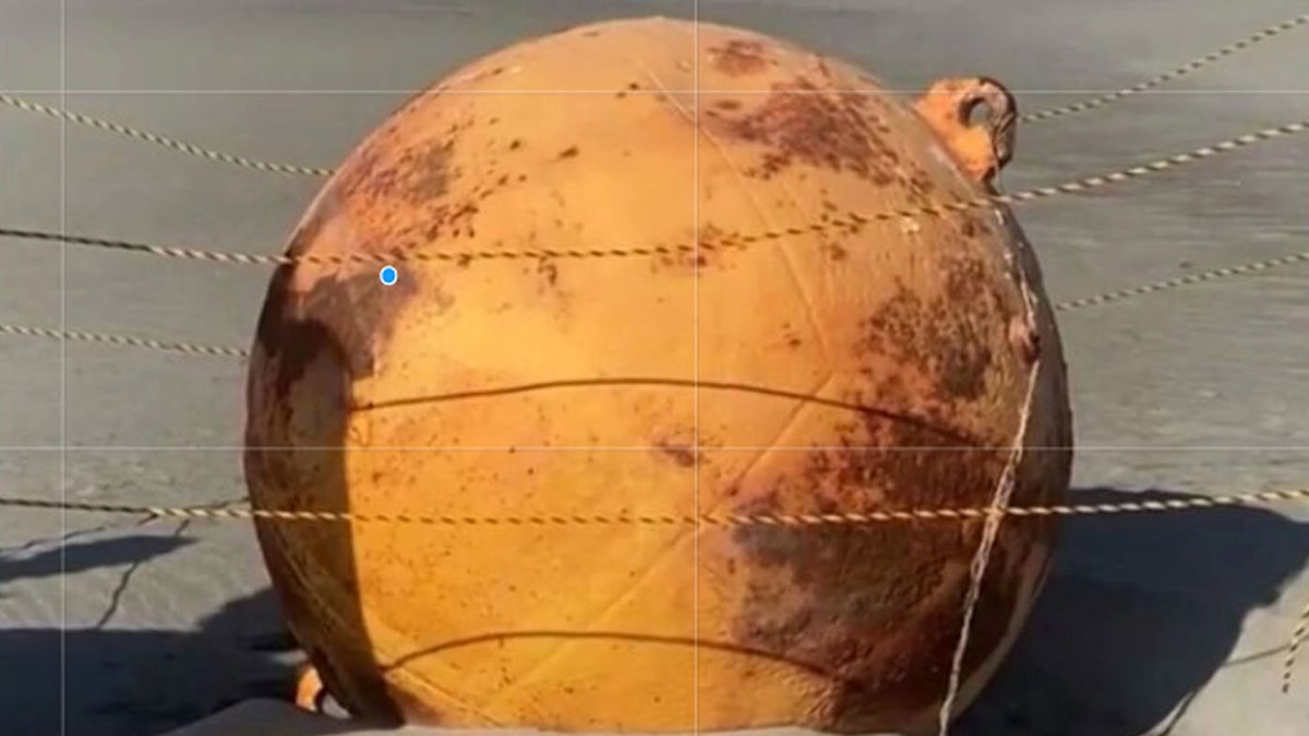 Mysterious sphere Japan: Unidentified object removed from beach | Nine ...