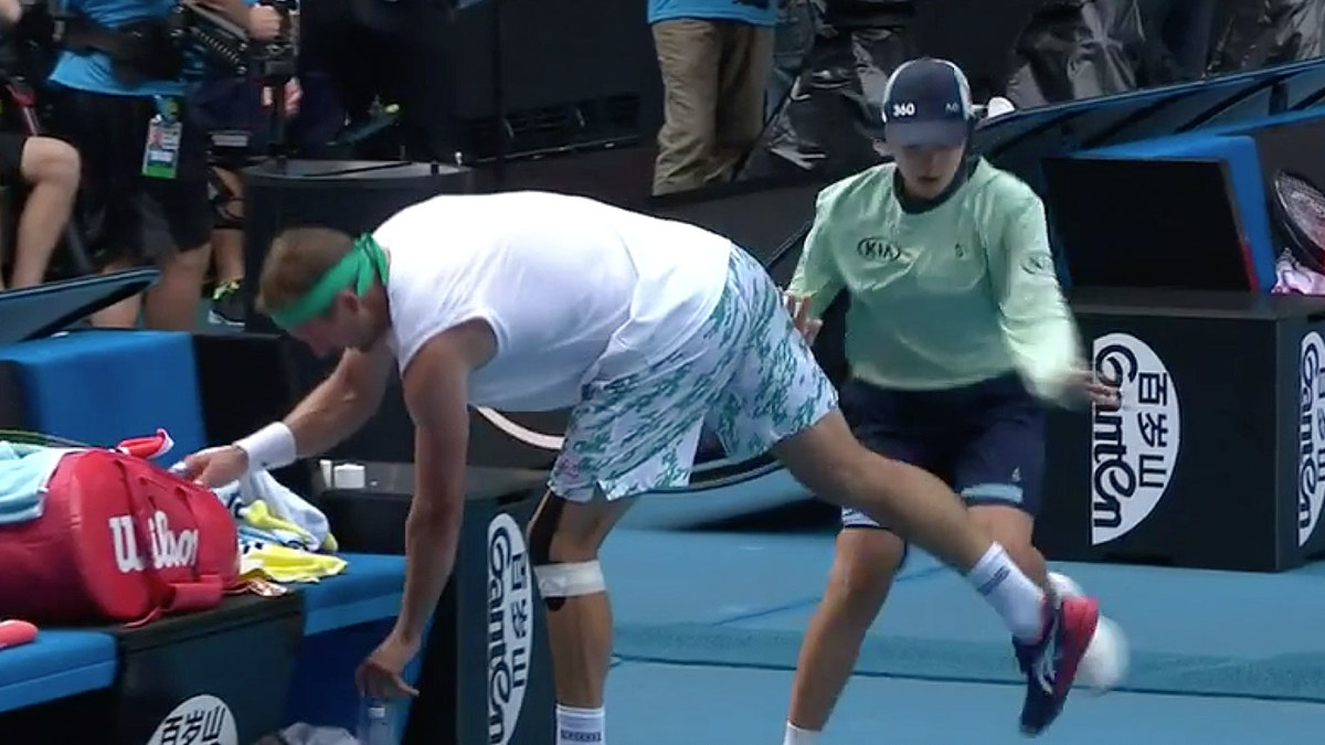 Australian Open: Ballkid colies with Tennys Sandgren during match ...