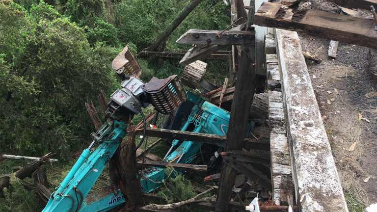 Excavator plunges as Qld bridge being dismantled collapses