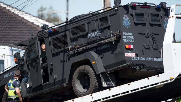 St Albans siege: Police armoured truck towed from scene after ramming fence