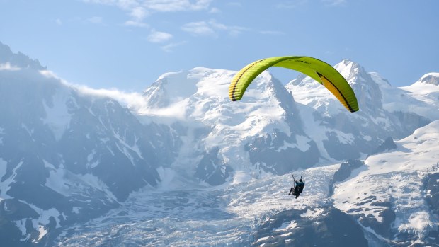 Paragliding above Chamonix in the French Alps, in the shadow of Mont Blanc