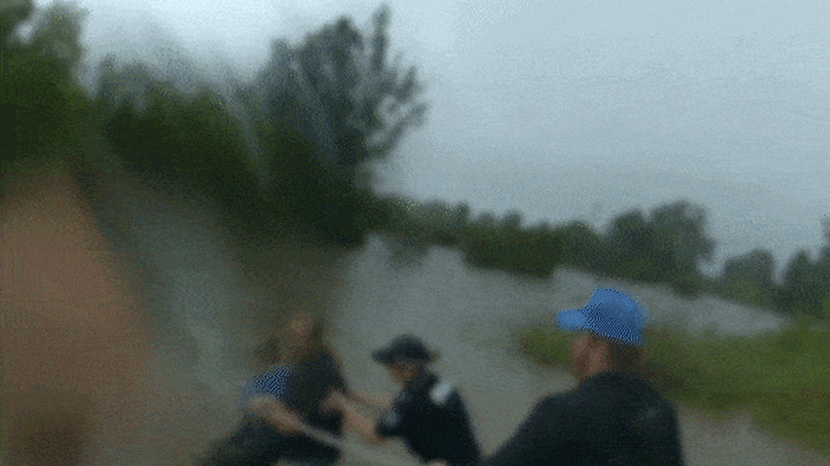 Ex-Tropical Cyclone Alfred: Police wade through deep floodwaters to ...