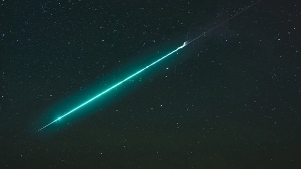 Meteor shines bright green in spectacular chance photo