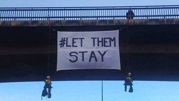 Pair brought back to earth after Eastern Freeway deportation protest