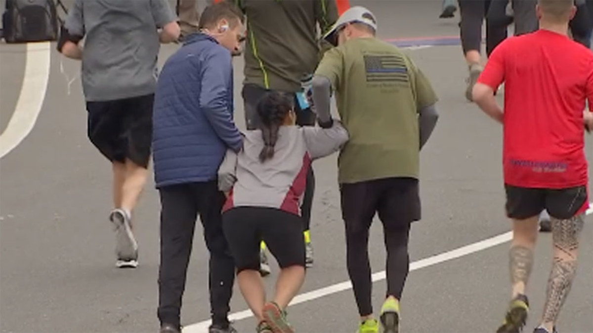 Struggling runner helped to finish line during Philadelphia Love Run ...