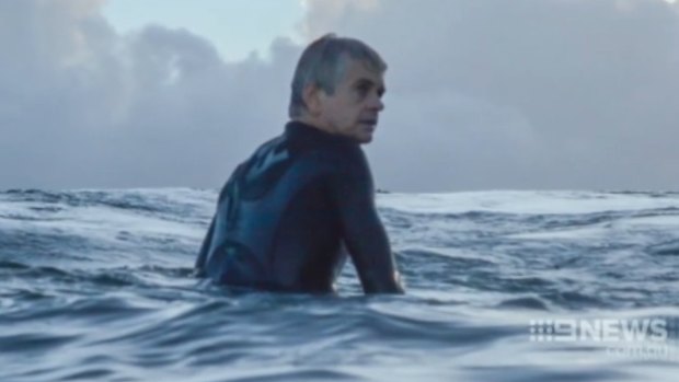 Former boxer Craig Ison's hand almost severed in punching great white shark