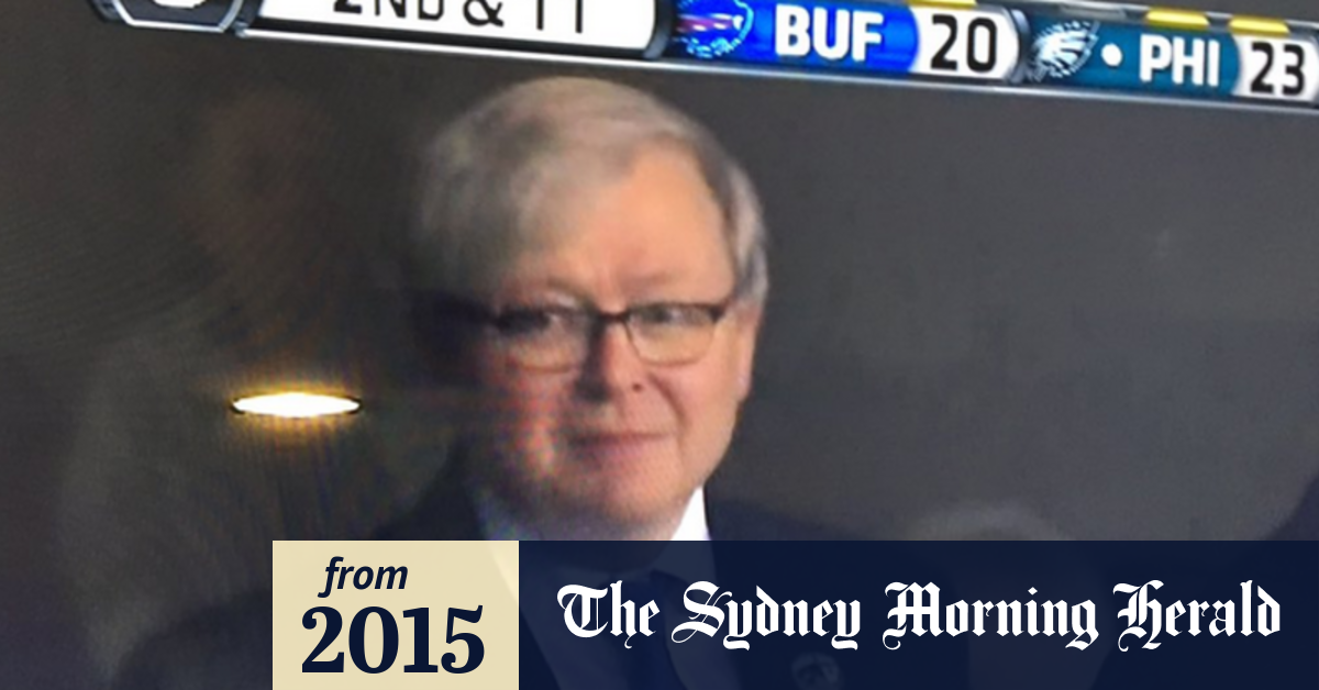 Kevin Rudd gives a hair flick for the cameras at NFL game