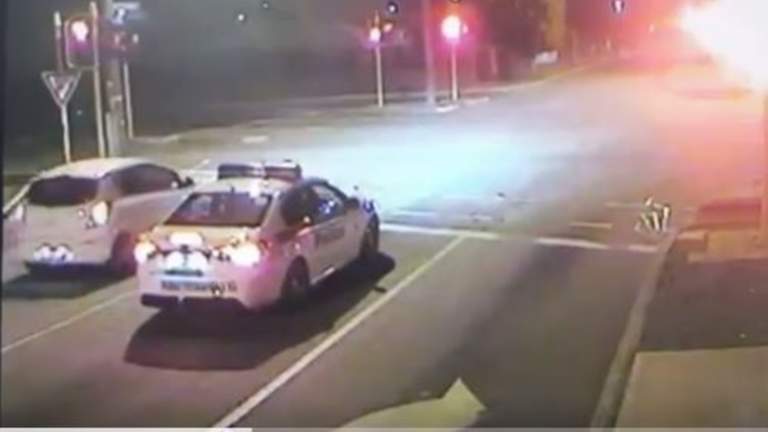 How stupid can you get? Car drives through red light right in front of ...