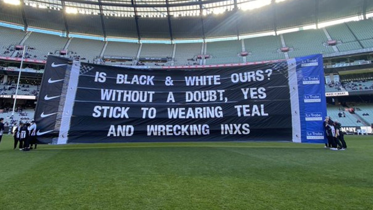 AFL: Collingwood banner takes shot at Port Adelaide over prison bar ...