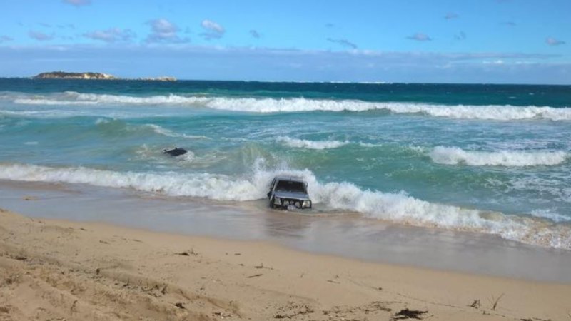 Extraordinary footage of two utes 'surfing' waves in the South West of WA