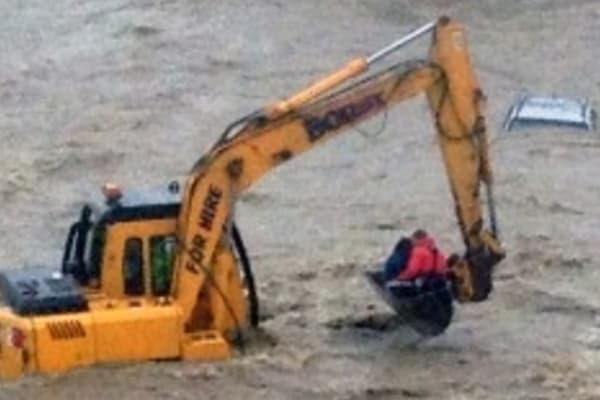 Heroes recognised for 'surreal' digger river rescue