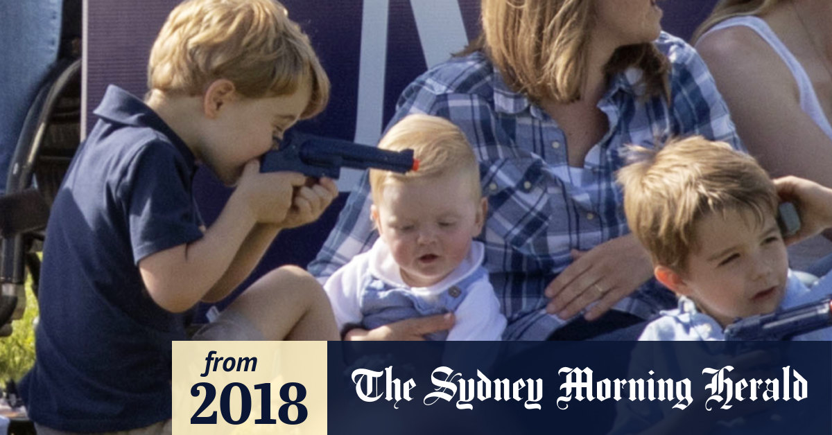 Prince George plays with toy gun at the polo