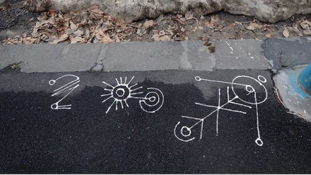 The story behind the cryptic drawings appearing on Melbourne footpaths