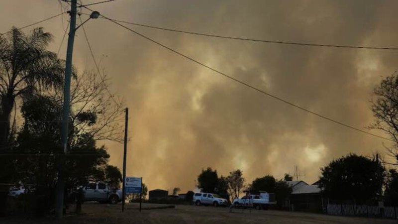 Two out-of-control bushfires force south-east Queensland residents to flee