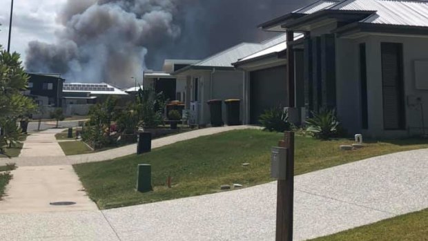 Sunshine Coast suburb evacuates as bushfire threatens homes