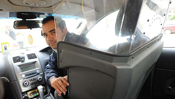 Taxi drivers find protective screens a mixed blessing