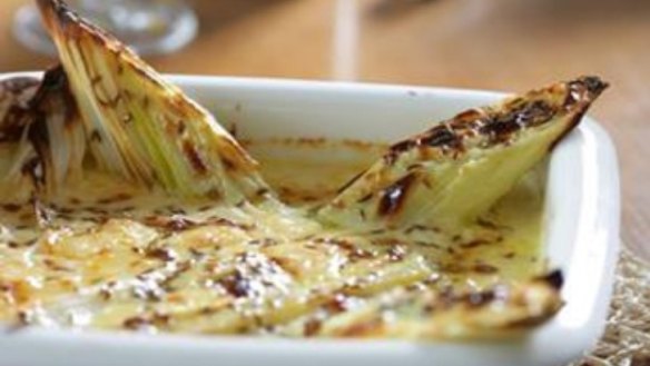 Baked leeks with cheese and caraway sauce