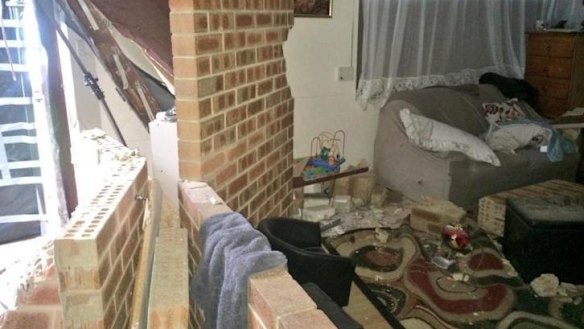 Woman's lucky escape: driver ploughs through house in Mirrabooka
