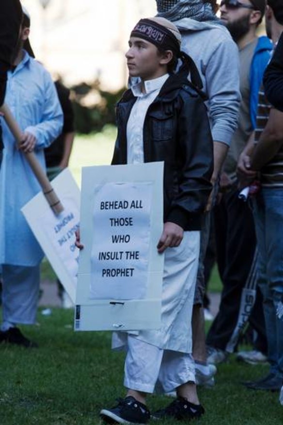 Children with beheading signs an outrage, says Scipione