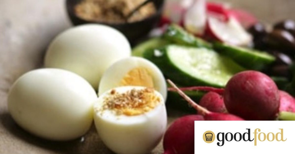 Hard-boiled eggs with dukkah, cucumber, olives and radish