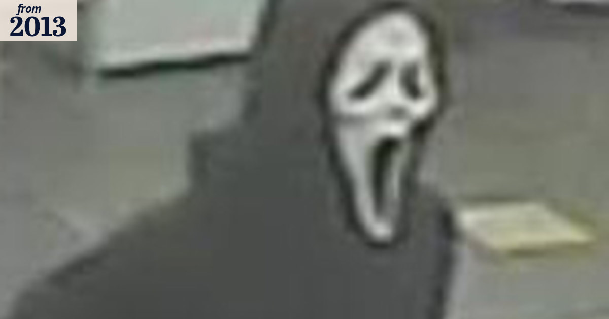 'Scream' mask robber threatens woman